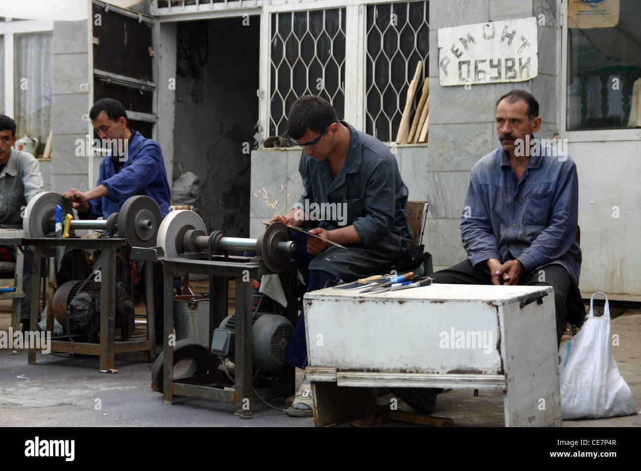 Man sharpening tools in Samarkand, Uzbekistan Stock Photo - Alamy
