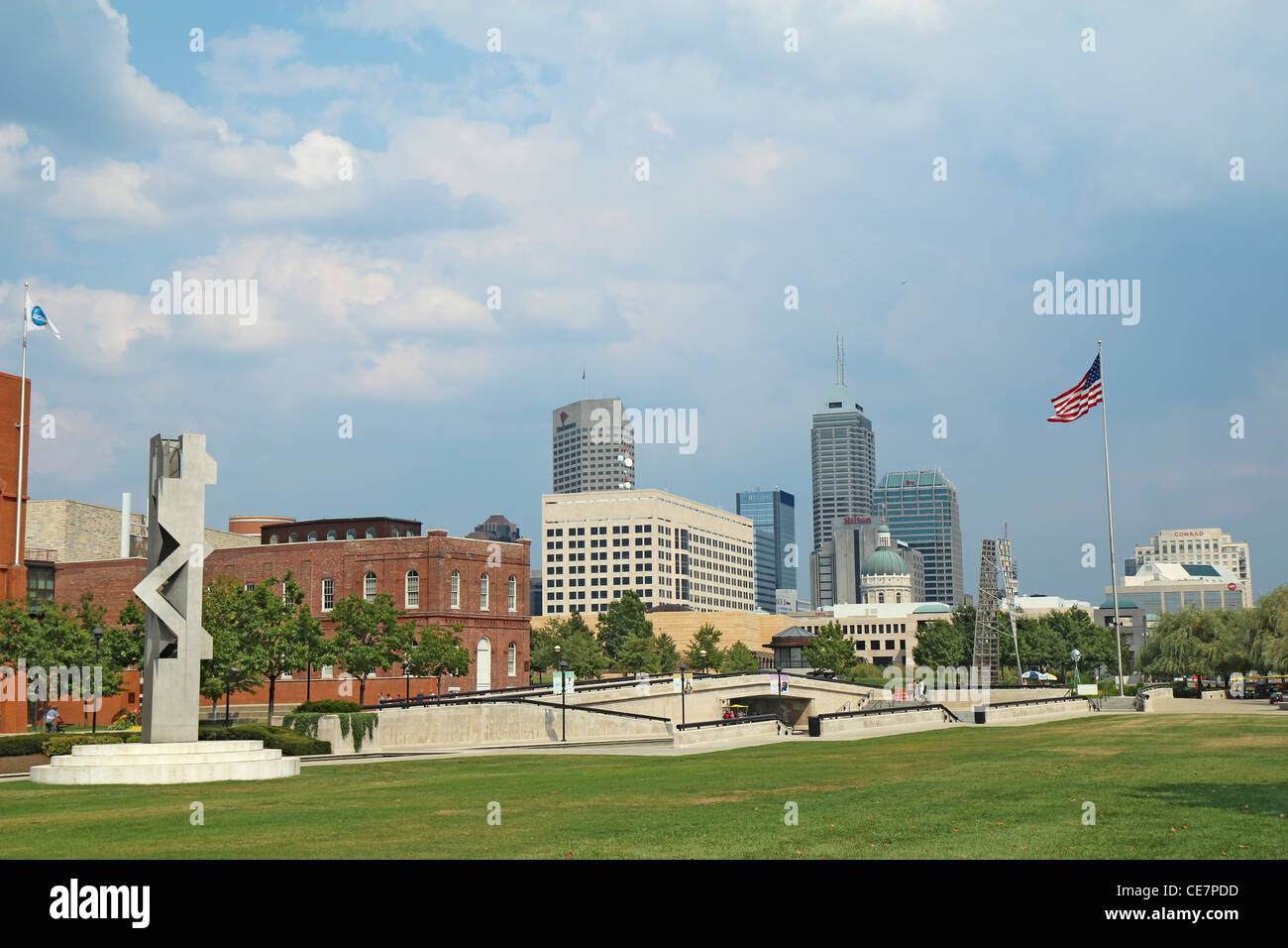 The skyline of downtown Indianapolis, Indiana and American flag Stock ...