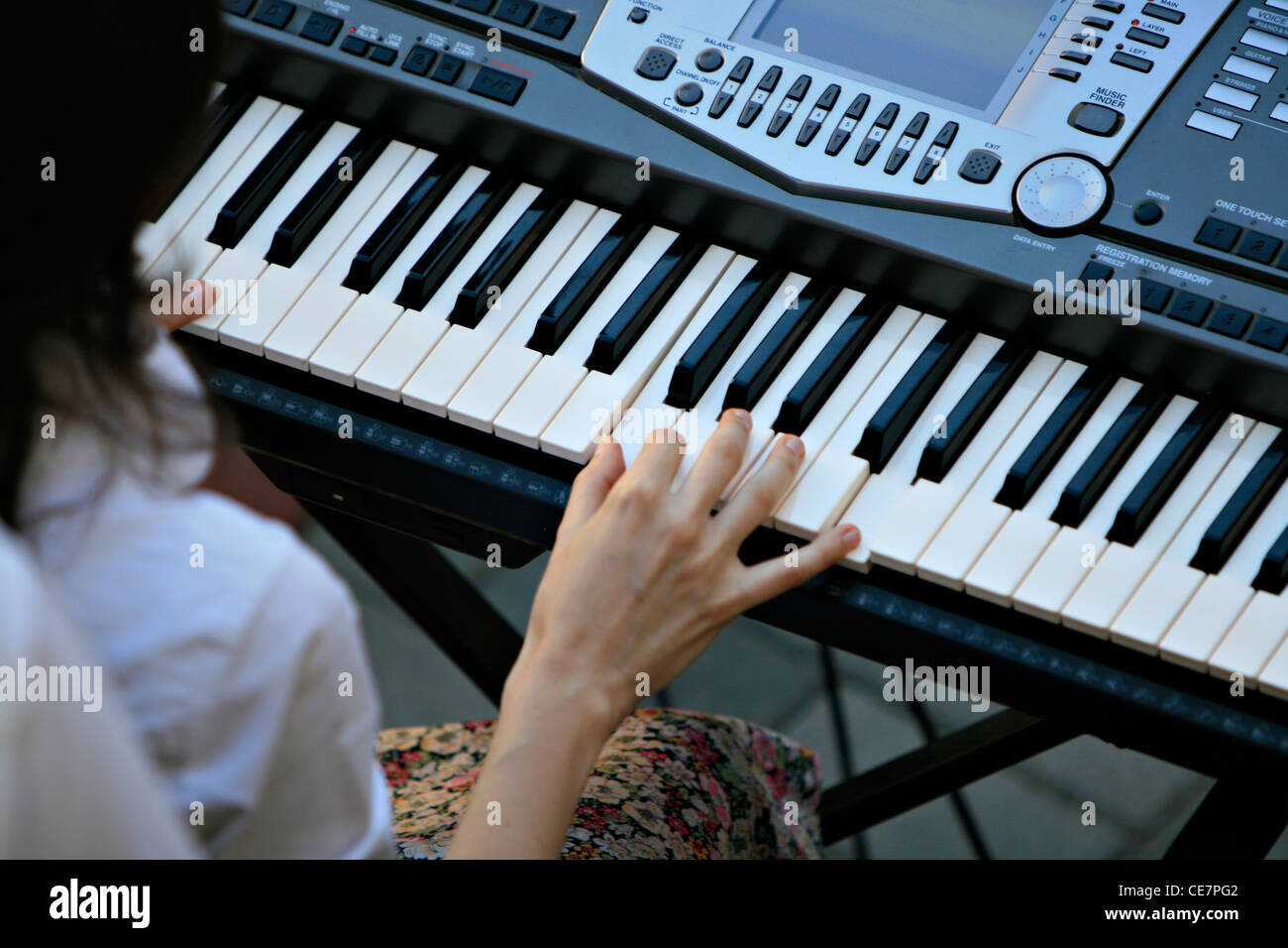 girl learning to play synthesizer Stock Photo - Alamy
