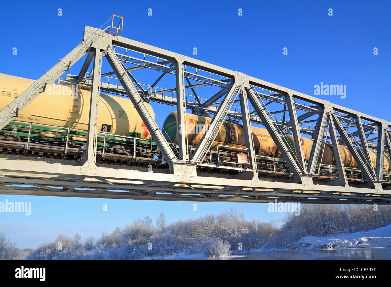 railway bridge through small river Stock Photo - Alamy
