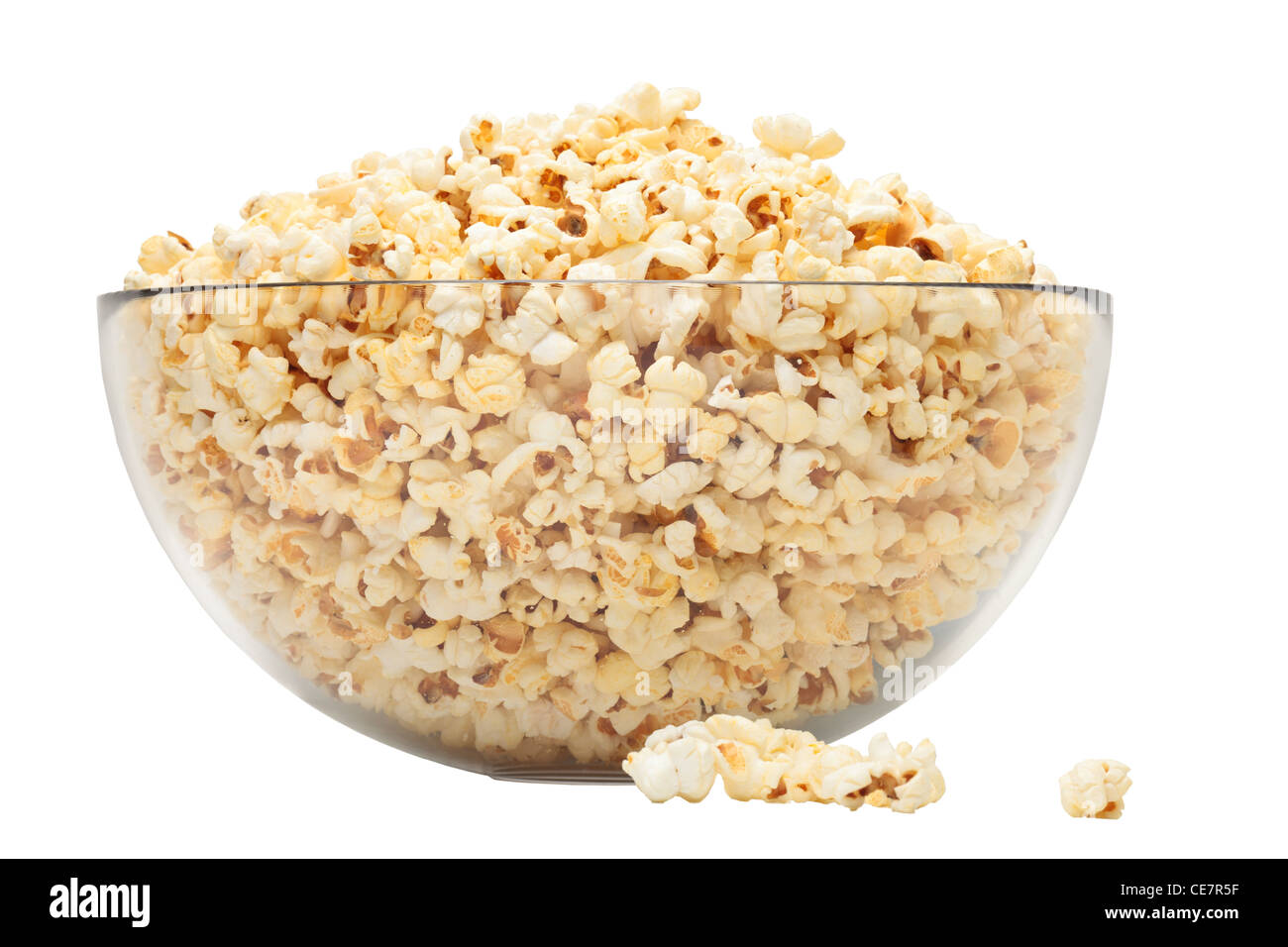popcorn in glass bowl over white background Stock Photo - Alamy