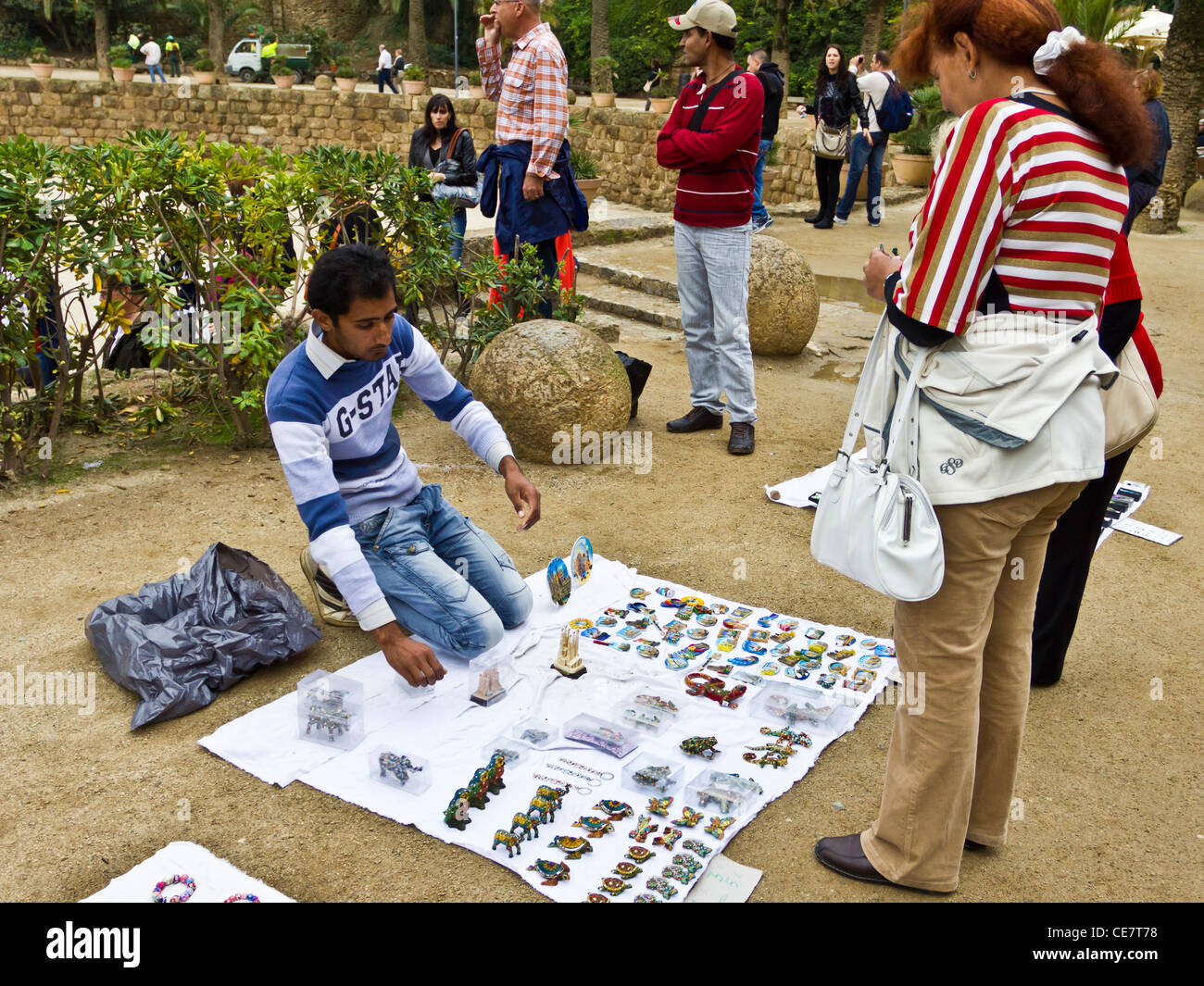 Tourists vendor at Park Guell garden complex in Barcelons, Spain ...