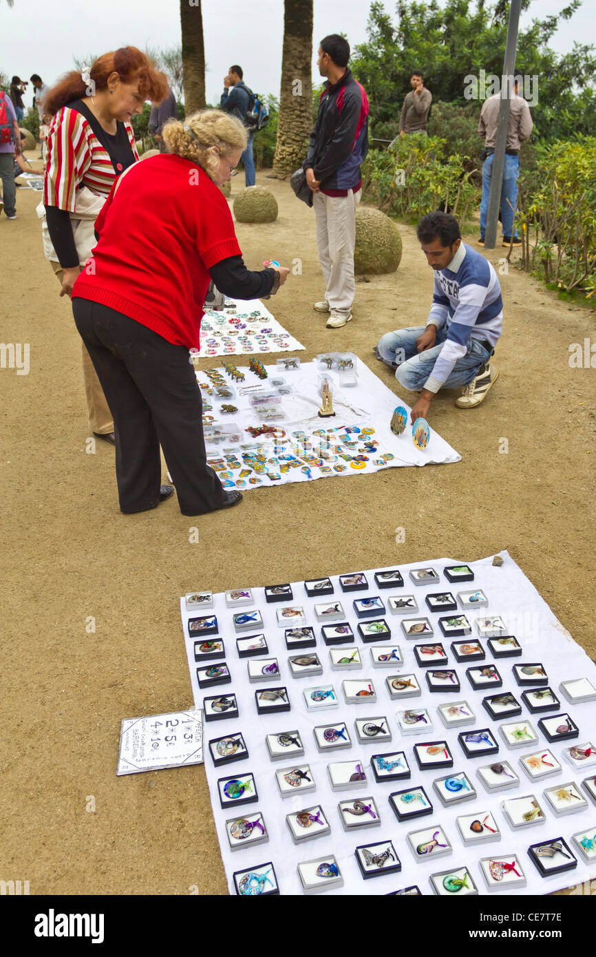 Tourists vendor at Park Guell garden complex in Barcelons, Spain ...