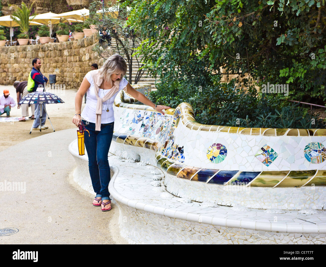 Tourists visiting Park Guell garden complex in Barcelons, Spain ...