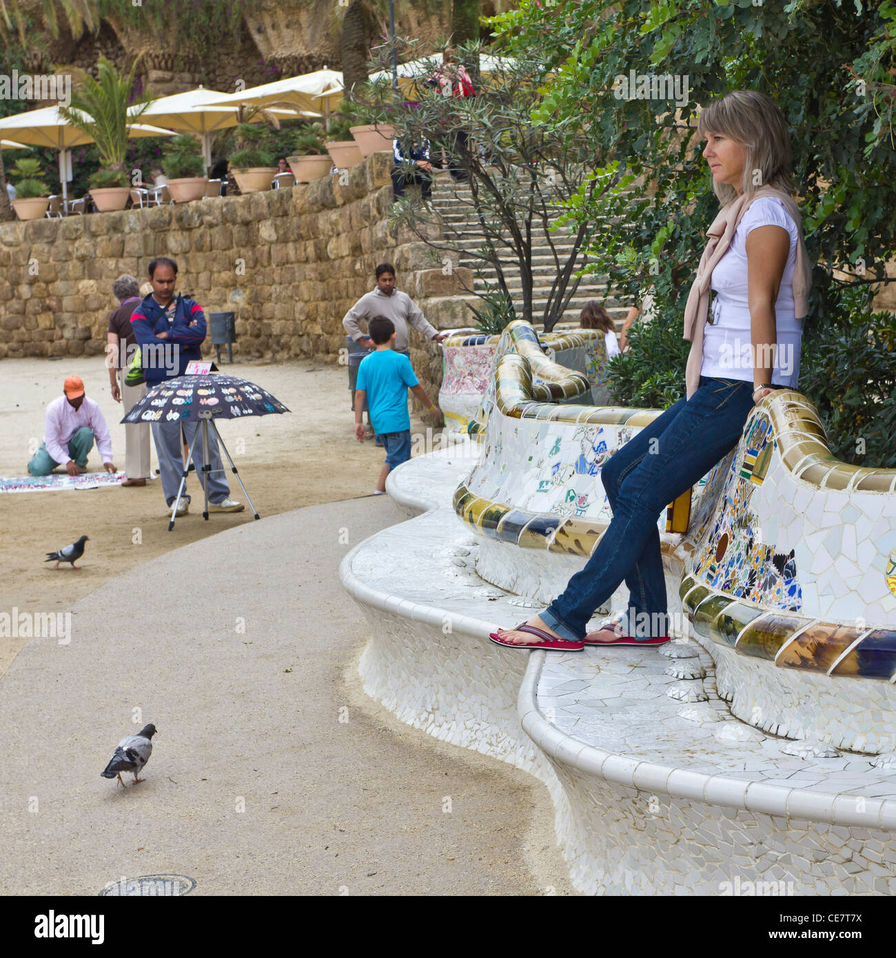 Tourists visiting Park Guell garden complex in Barcelons, Spain ...