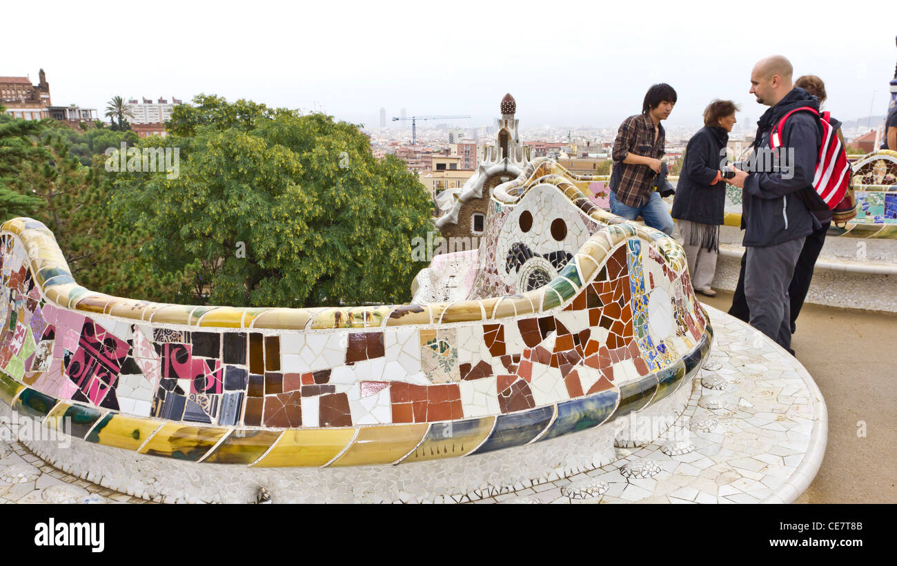 Tourists visiting Park Guell garden complex in Barcelons, Spain ...