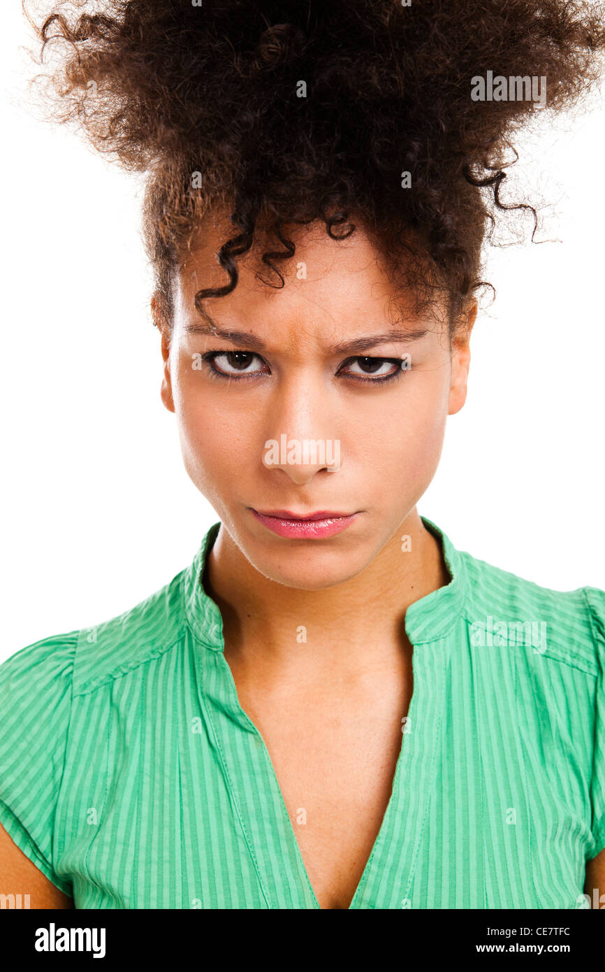 Portrait of a frustrated and angry young woman. Studio shot with ...
