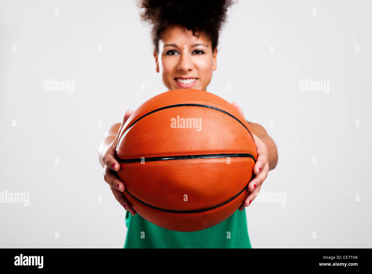 Beautiful athletic woman with basketball. Studio shot Stock Photo - Alamy