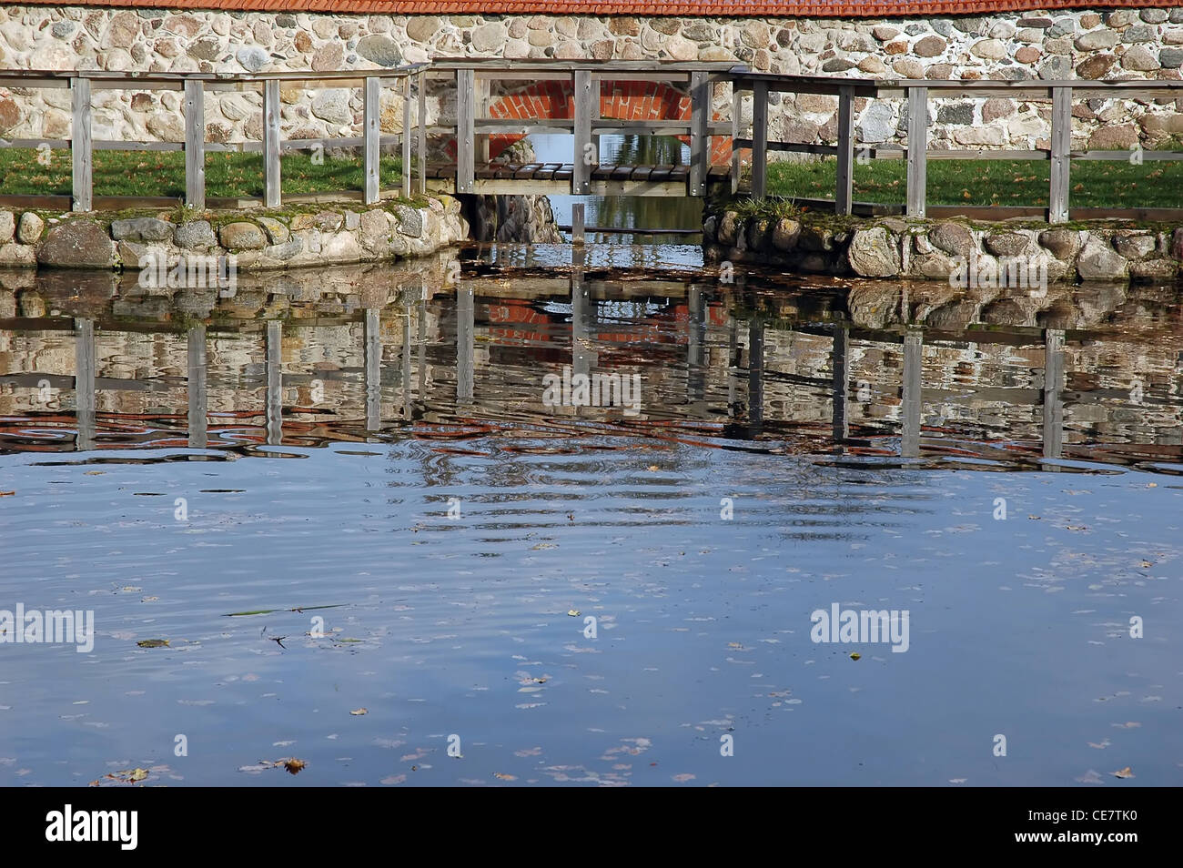 Water pouring through the small dam gates. Luke manor in Estonia Stock ...