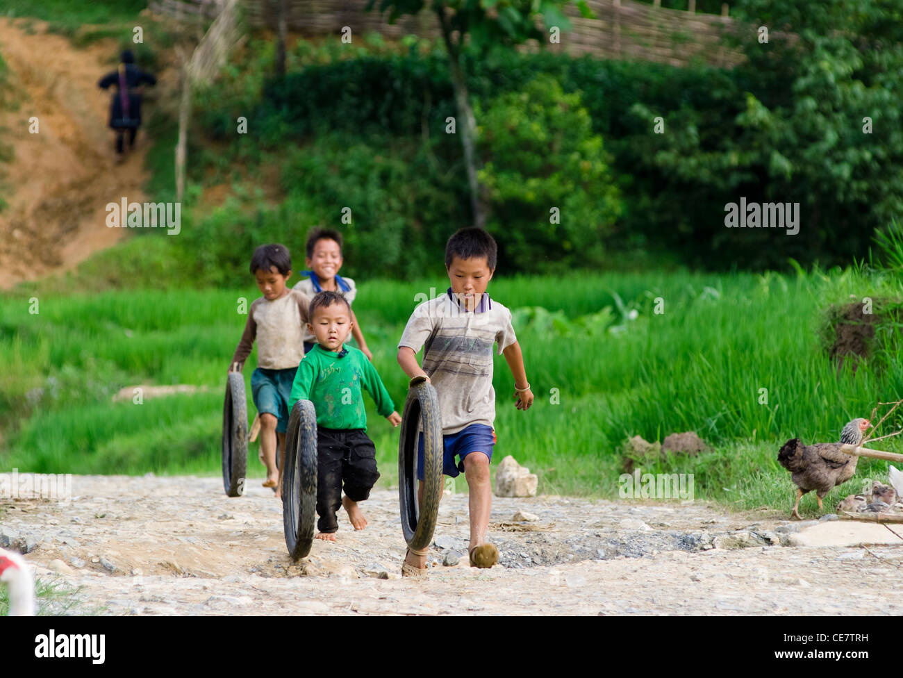 Hilltribe boys enjoy tire-spinning competition in Sapa, Vietnam Stock ...