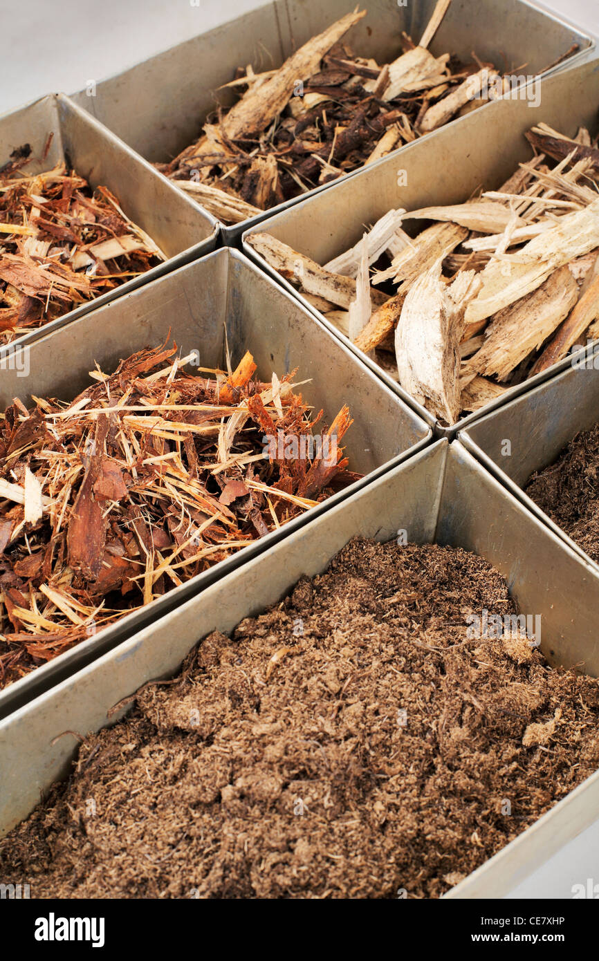 Biomass fuel samples to be analyzed in the lab: Wood, wood bark and ...