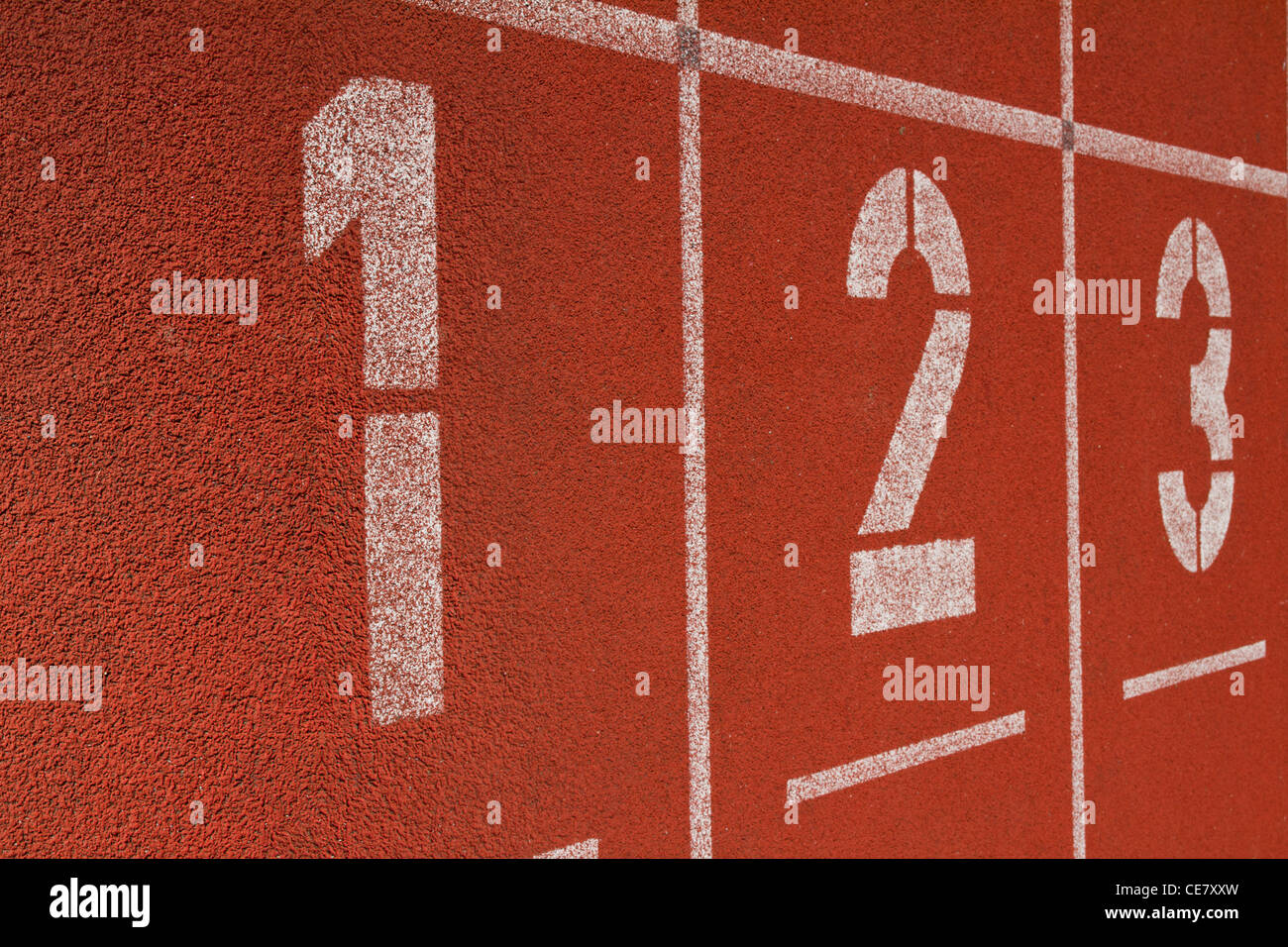 Start numbers on the ground of a racetrack Stock Photo - Alamy