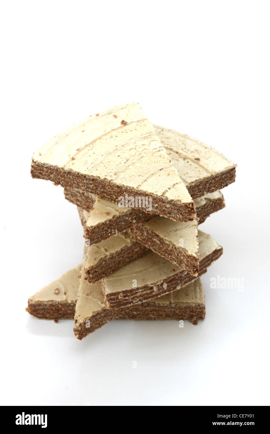 Stack of wafers in triangle shape with chocolat filling on white ...