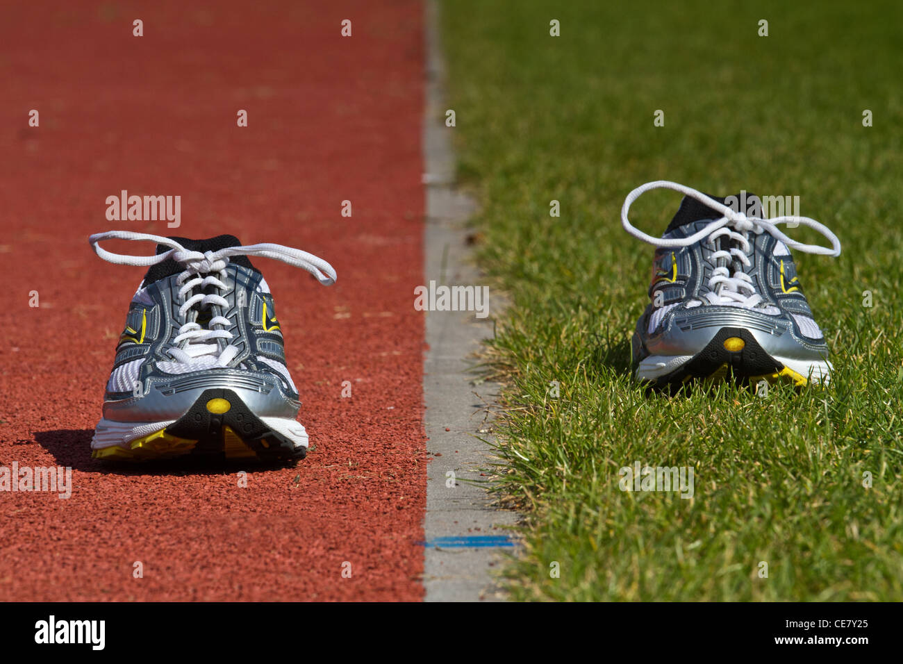 Empty runners on racetrack and green Stock Photo - Alamy