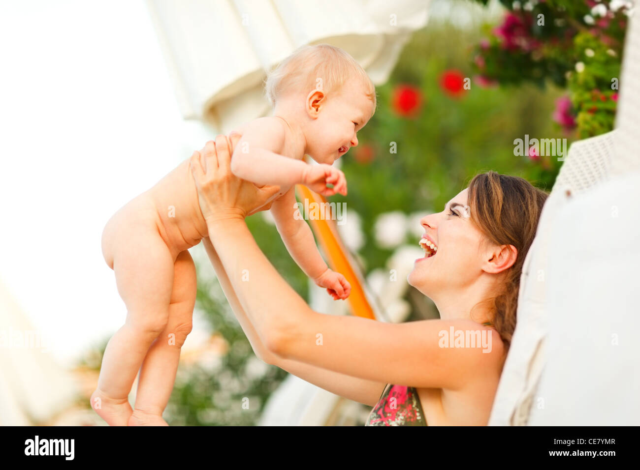 Beautiful young mom playing adorable hi-res stock photography and ...