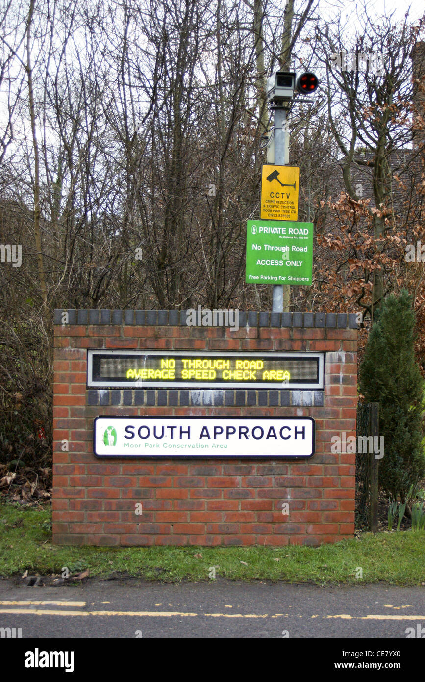 A CCTV camera and speed limit warning built into street sign on private ...