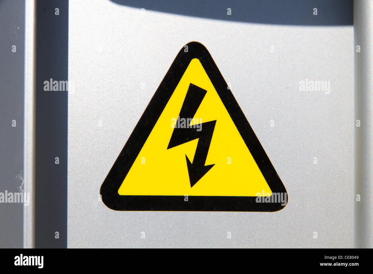 warning power electricity sign yellow high-voltage Stock Photo - Alamy