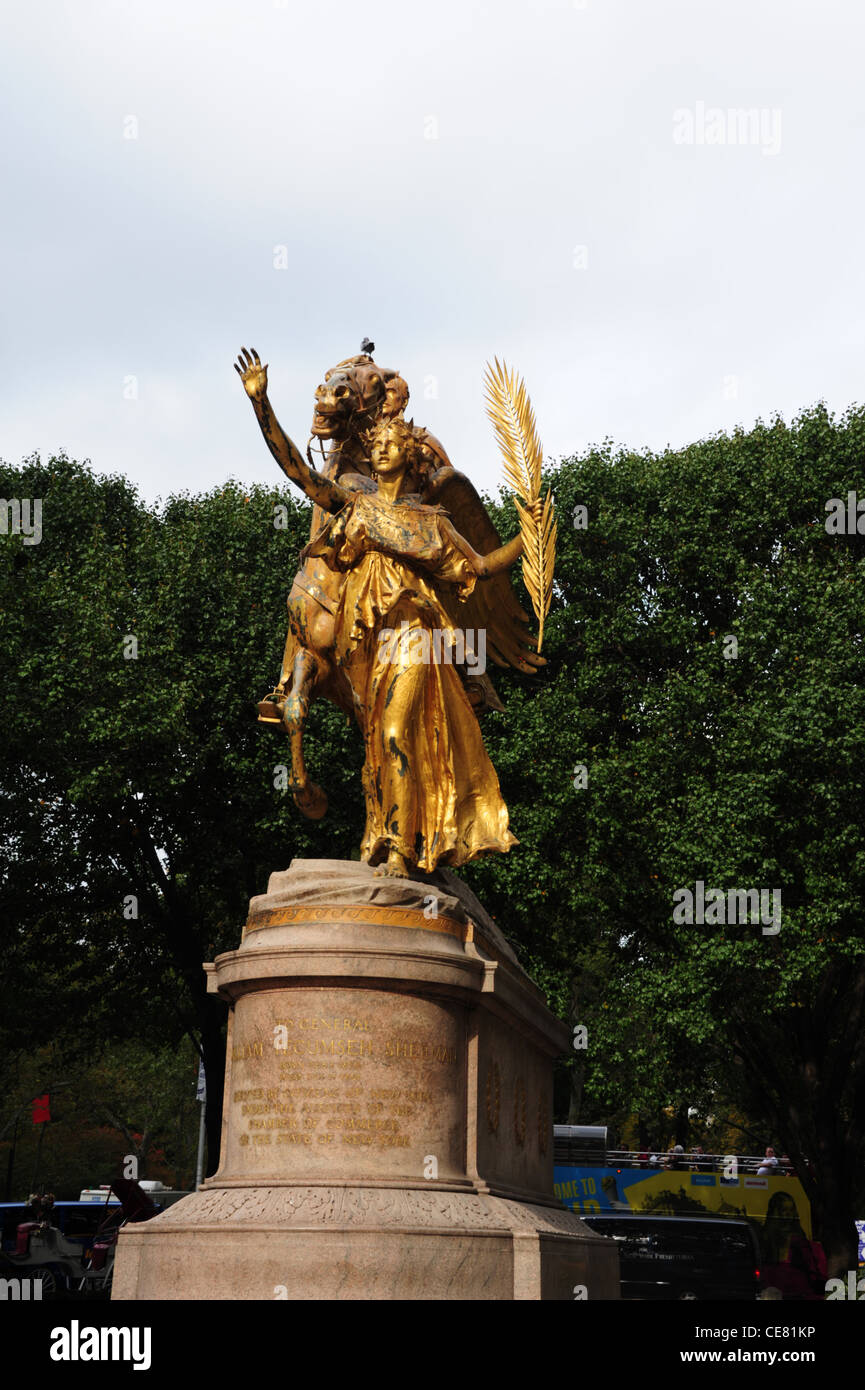 Grey sky autumn sun portrait gilded statue Sherman Monument front green ...