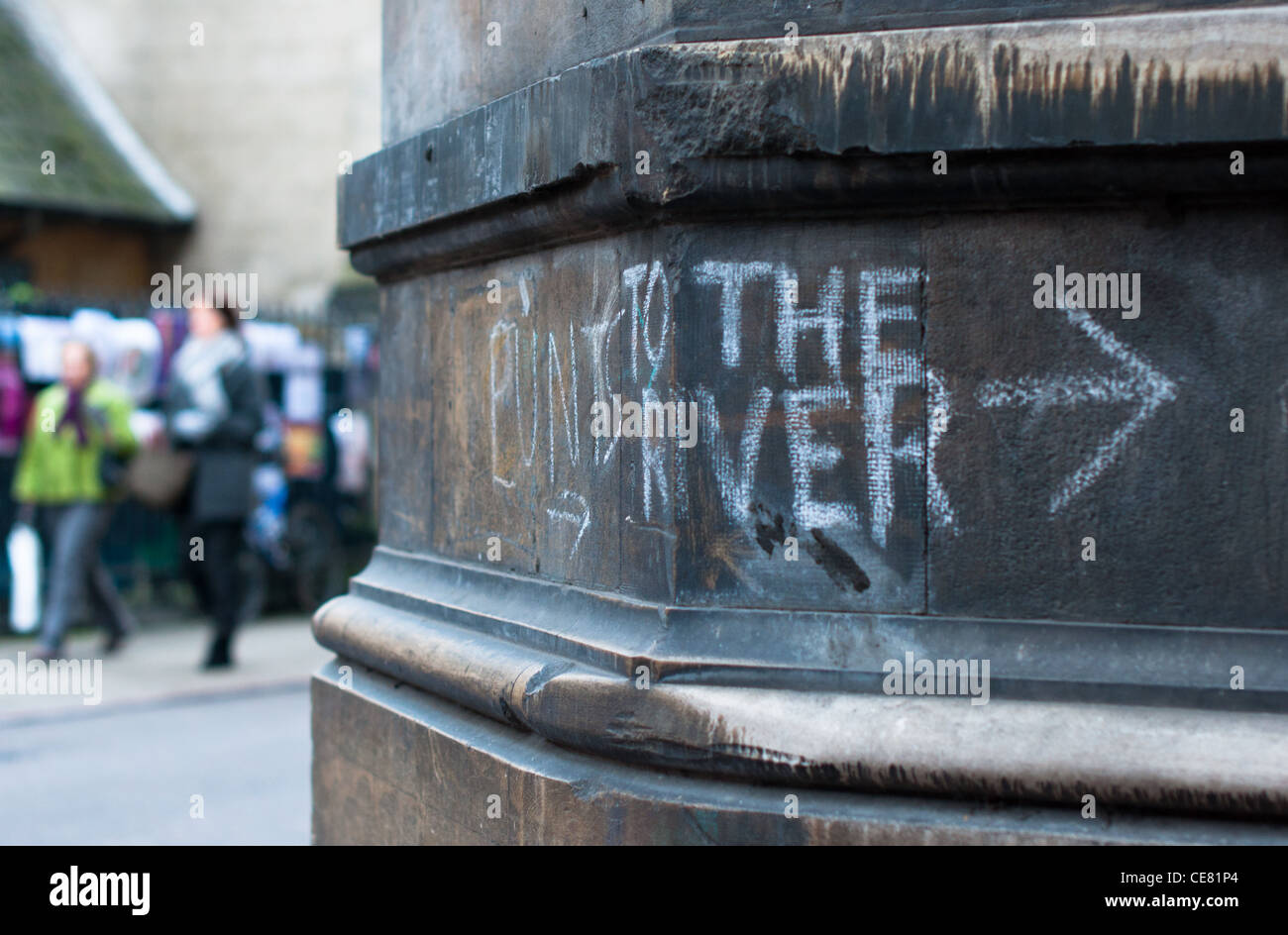 Directions to the river Cam and punting written in chalk in Cambridge ...