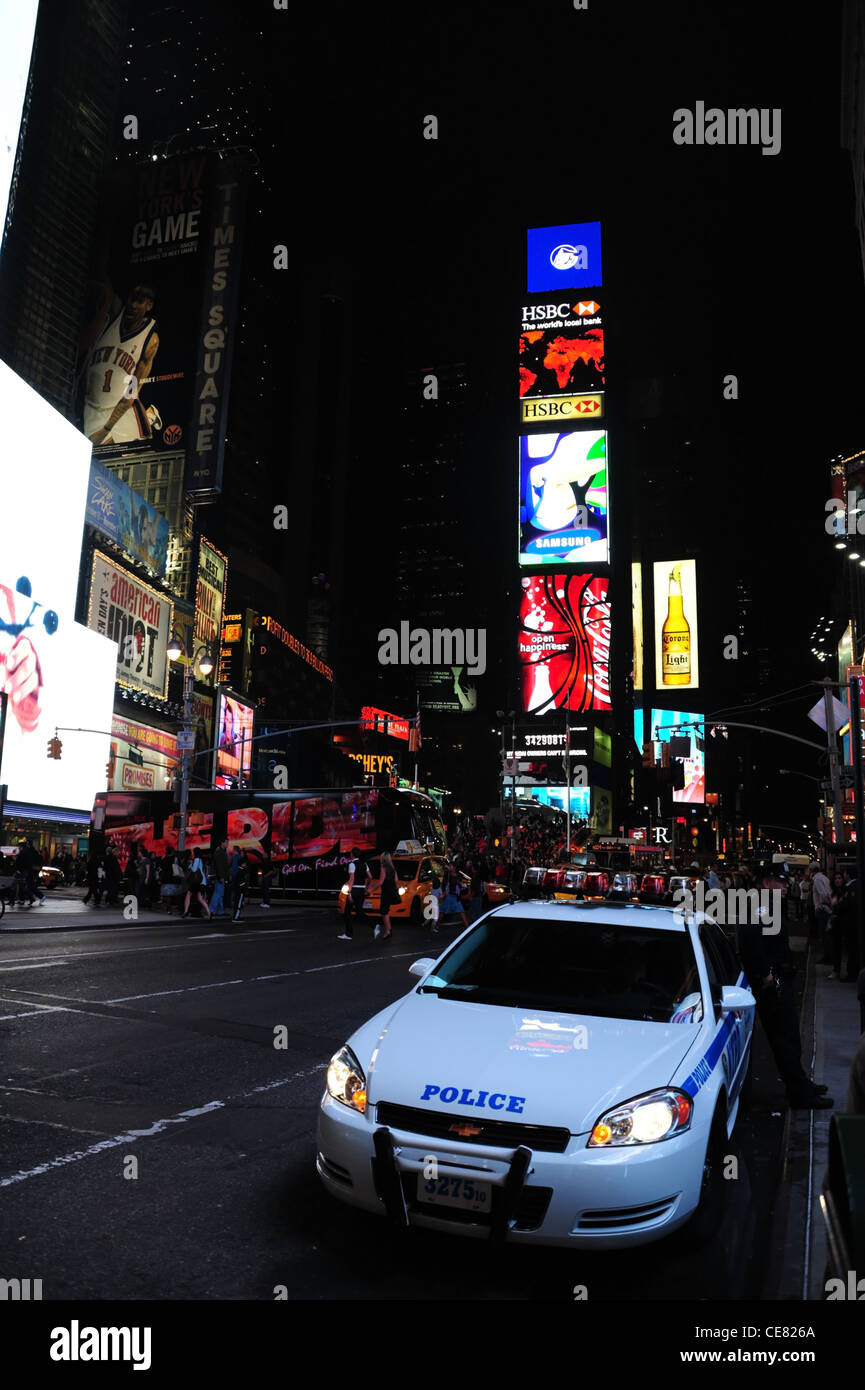 Night neon portrait NYPD police car parked 7th Avenue, towards West ...