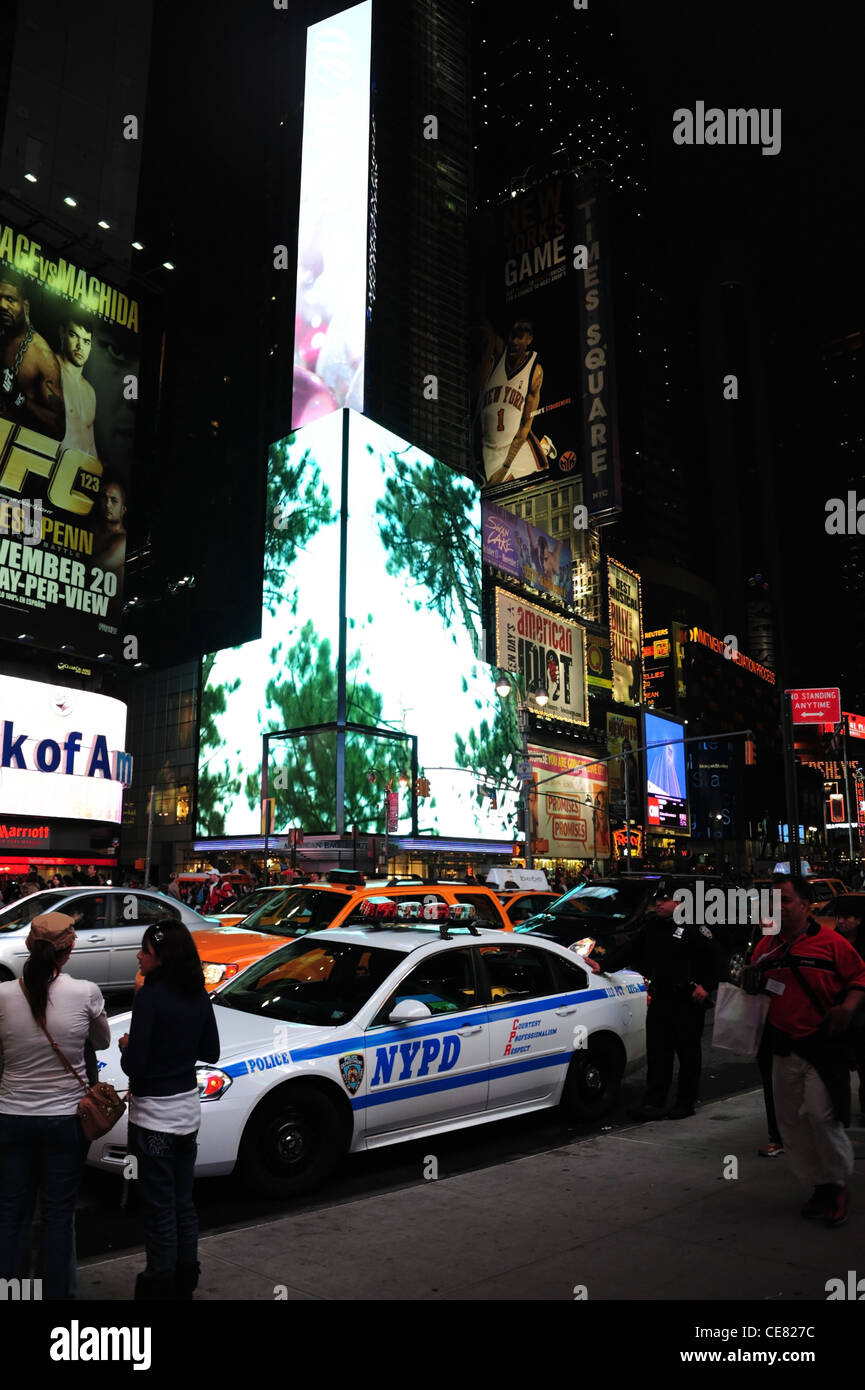 Night neon portrait traffic people NYPD policeman police car parked 7th ...
