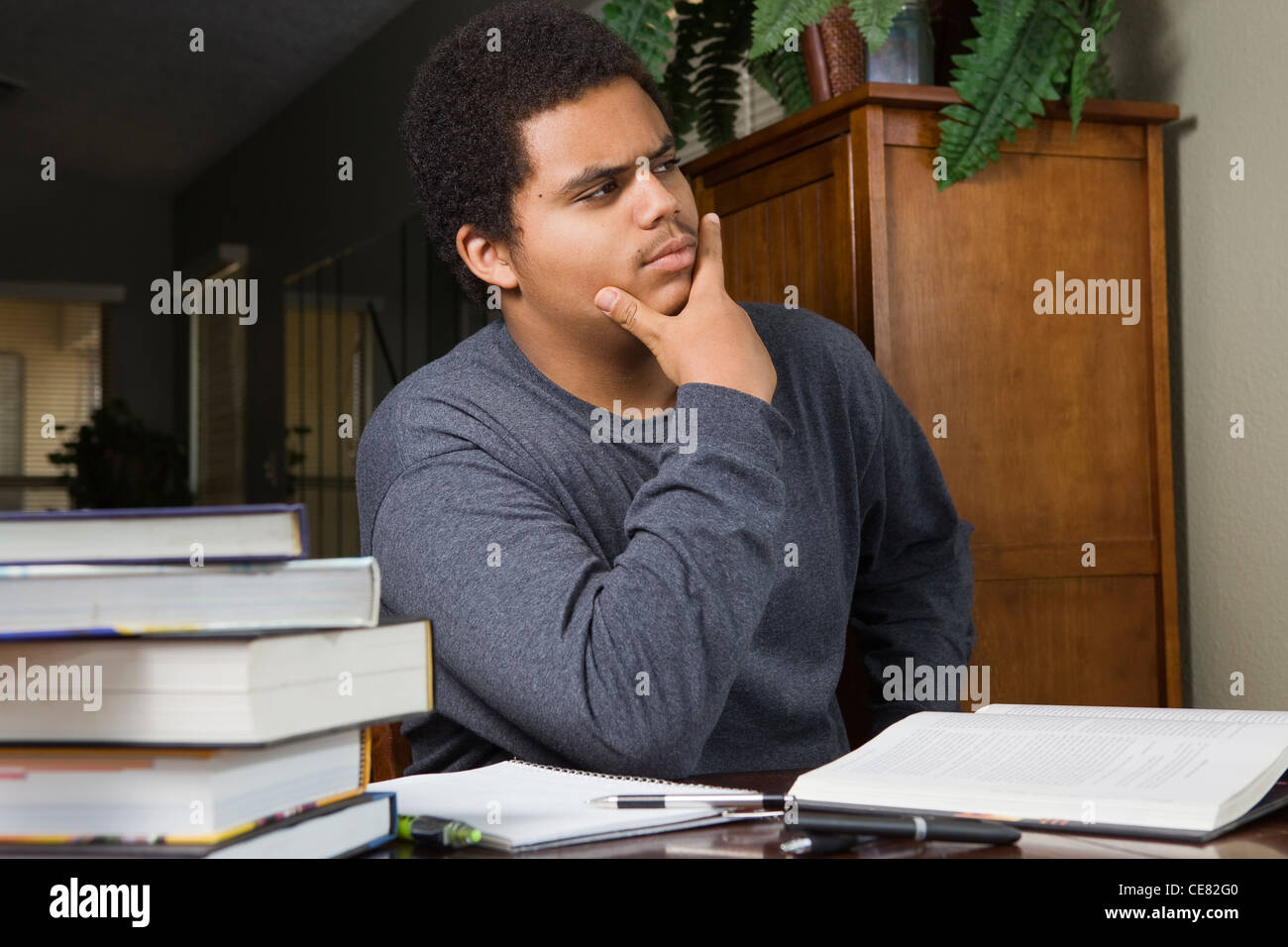 African american teenager male thinking hi-res stock photography and ...