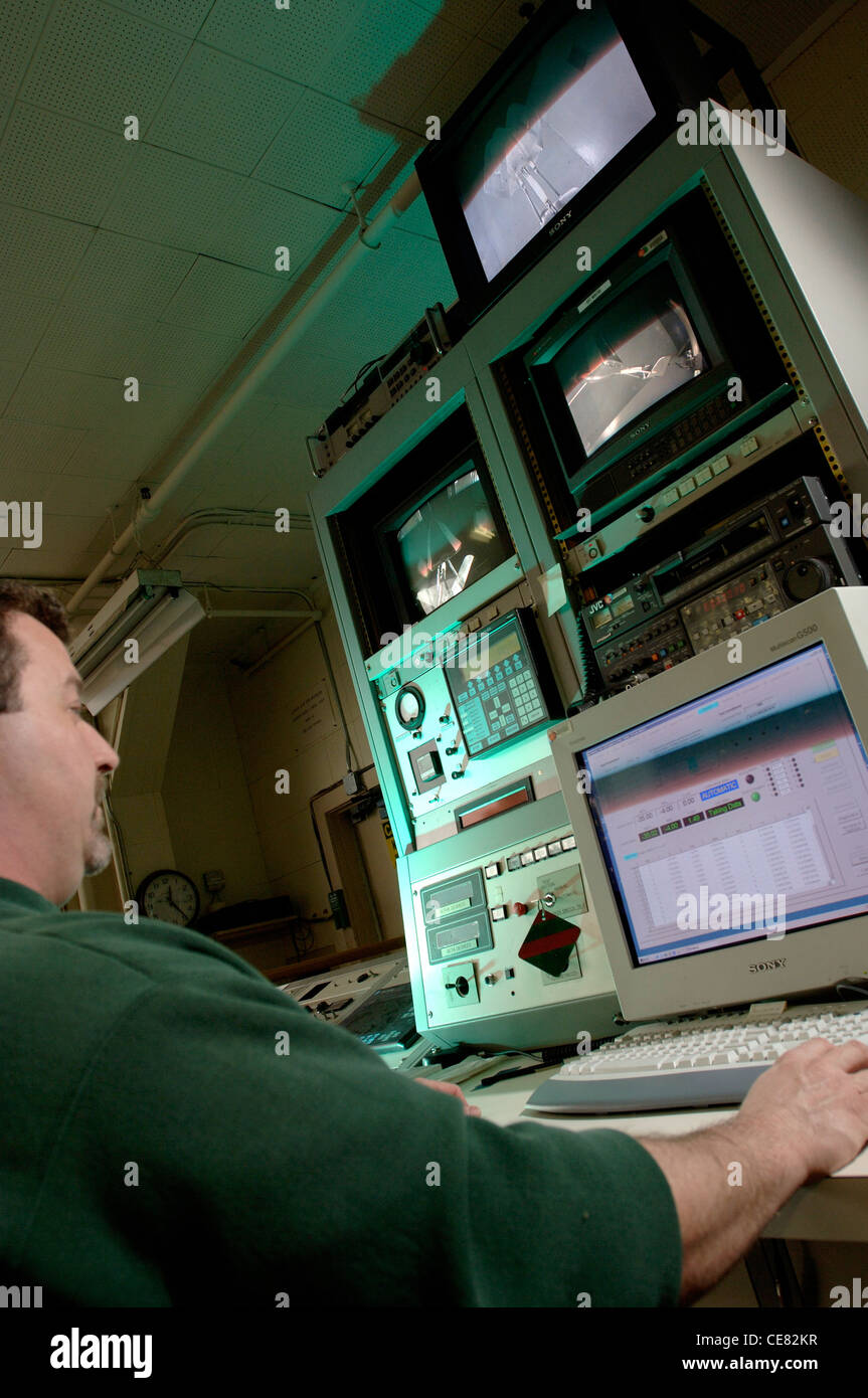 Earl Harris, a mechanical engineering technician at NASA, monitors wind ...