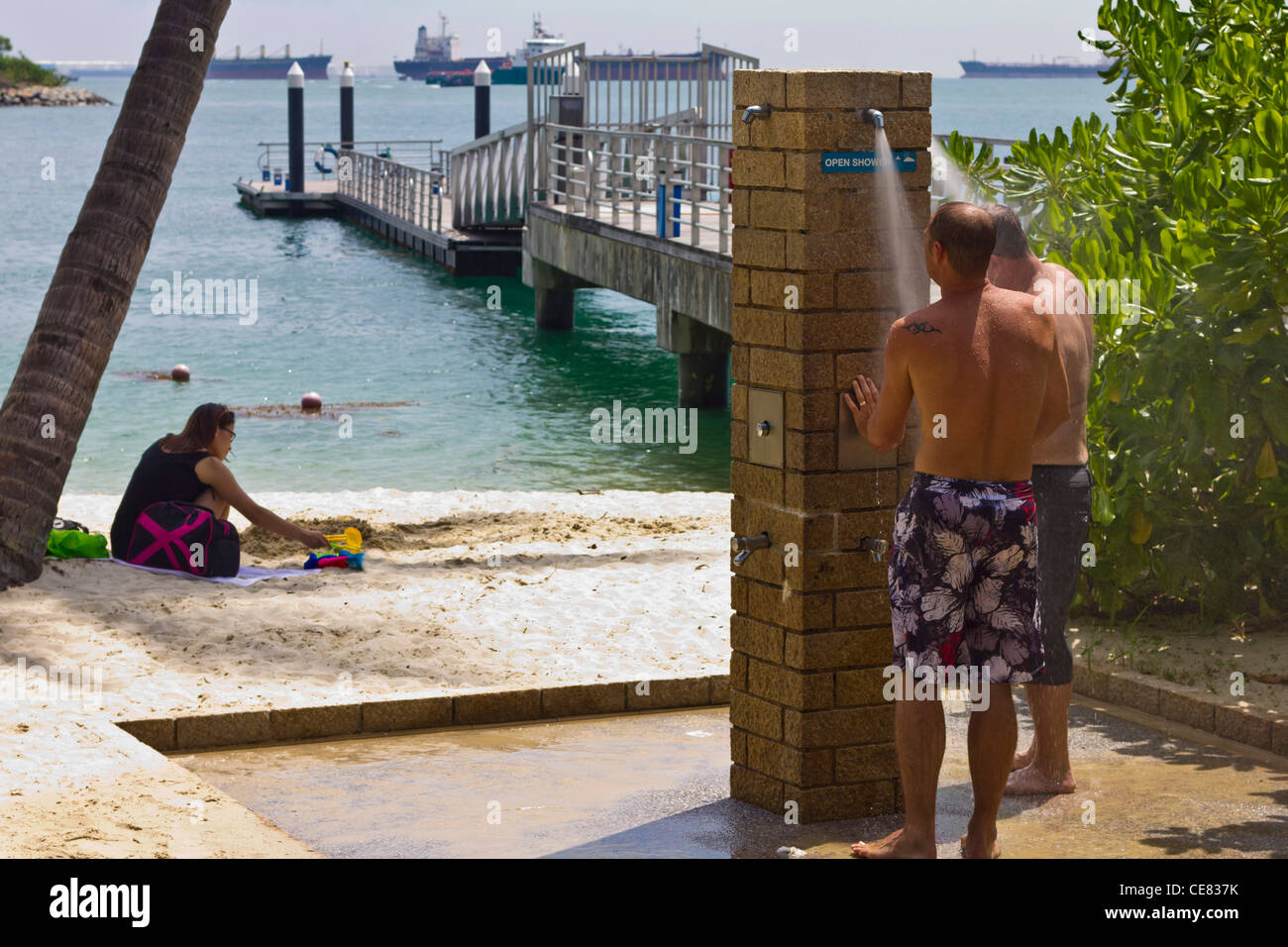 Two men taking shower hi-res stock photography and images - Alamy