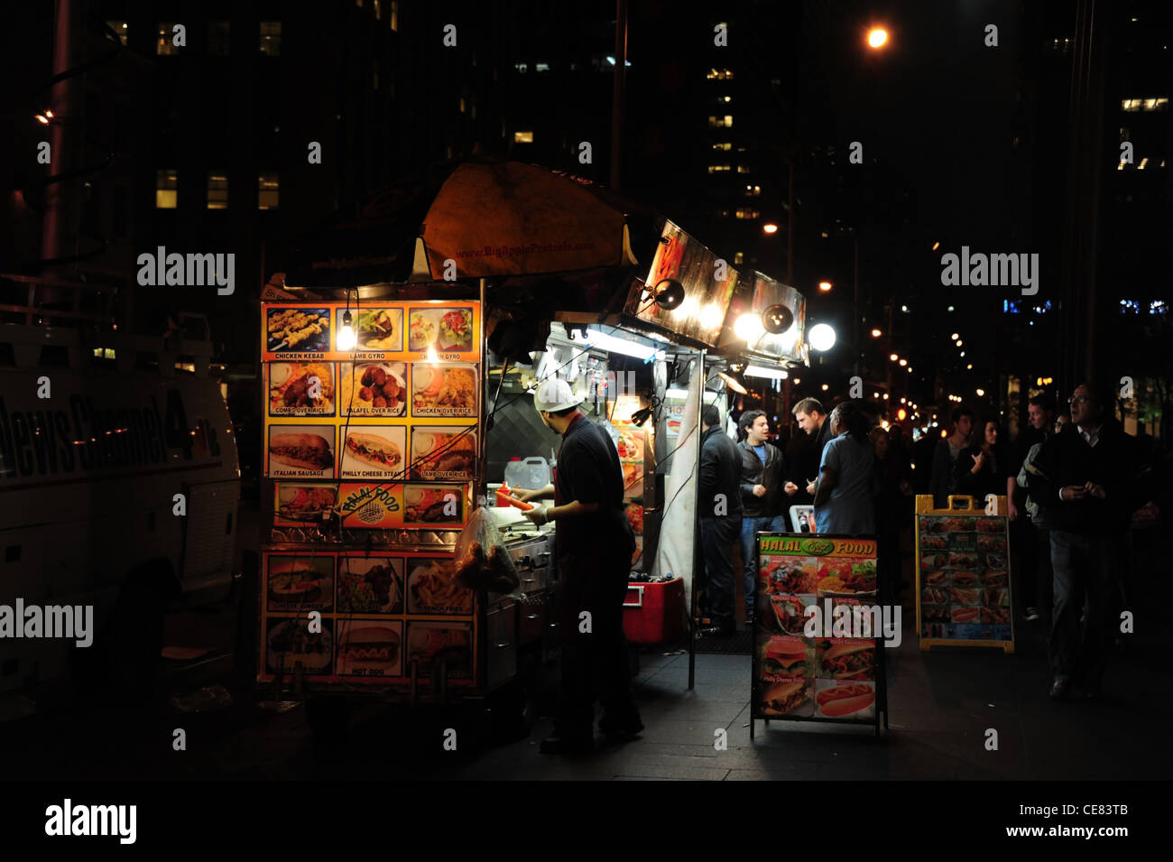 Night view people buying food two Halal fast-food stalls electric ...