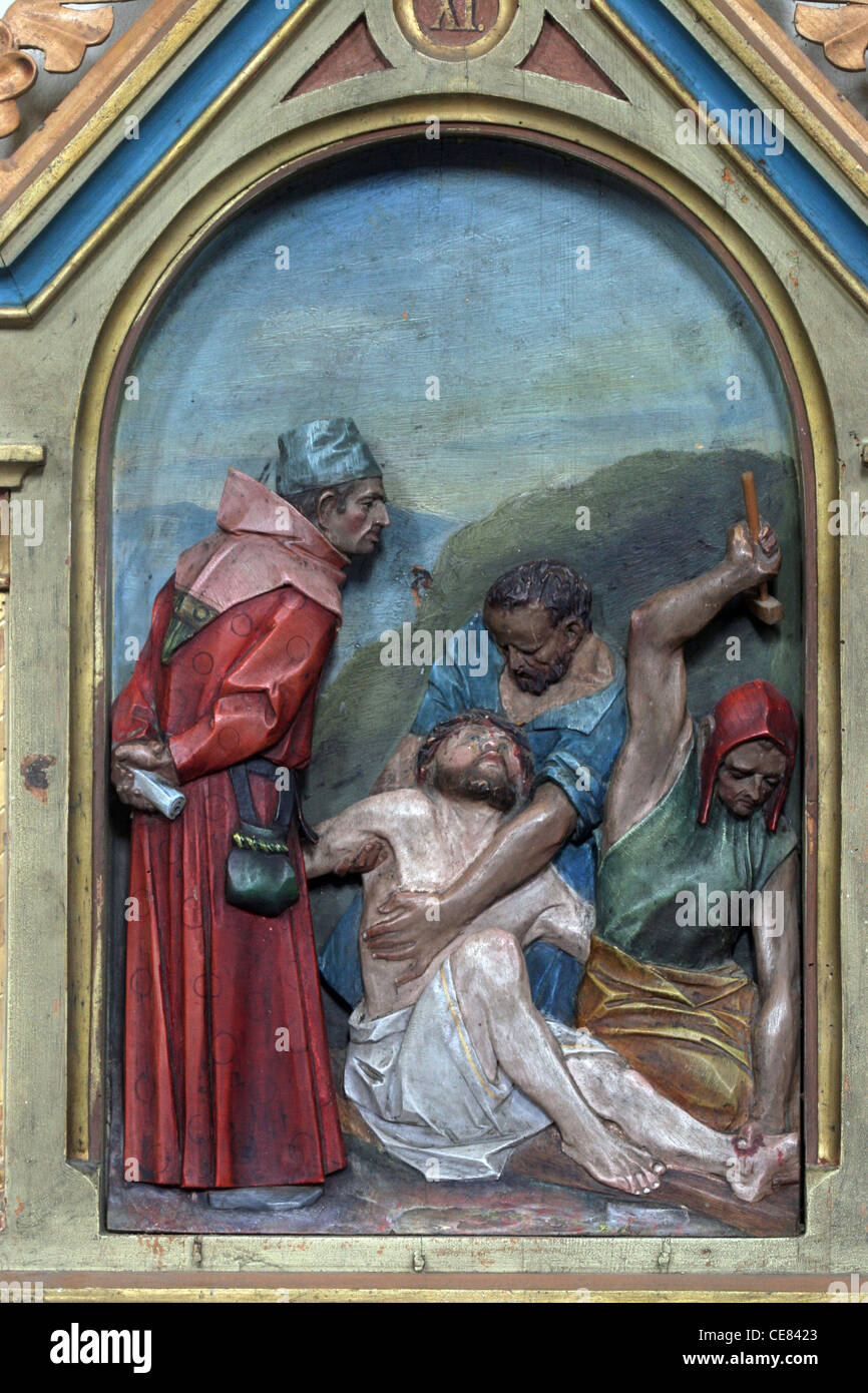 11th Stations of the Cross, Crucifixion: Jesus is nailed to the cross Stock Photo - Alamy