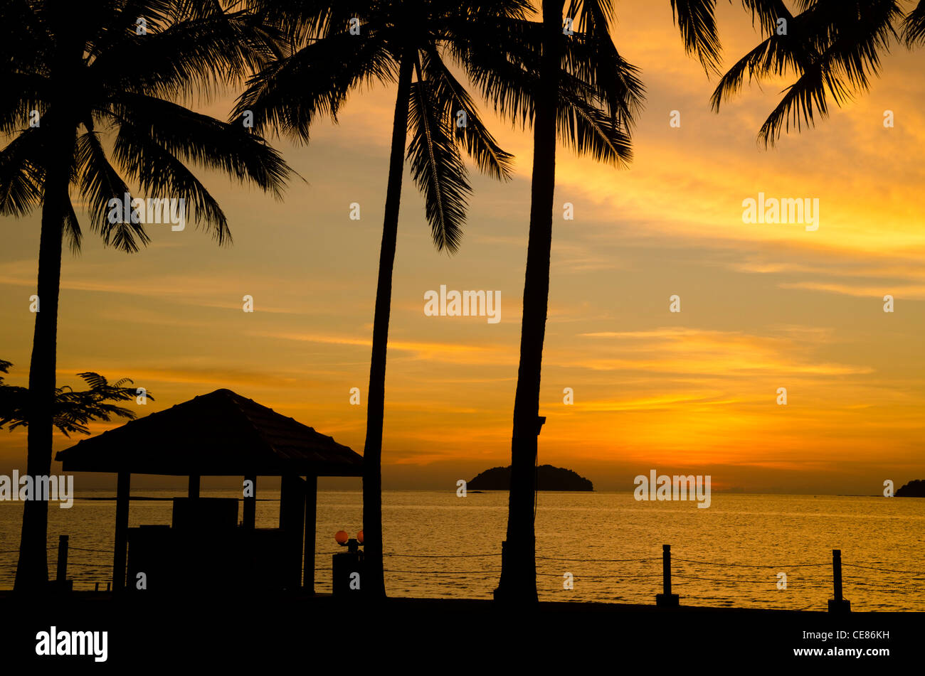 hut on a beach sunset Stock Photo - Alamy