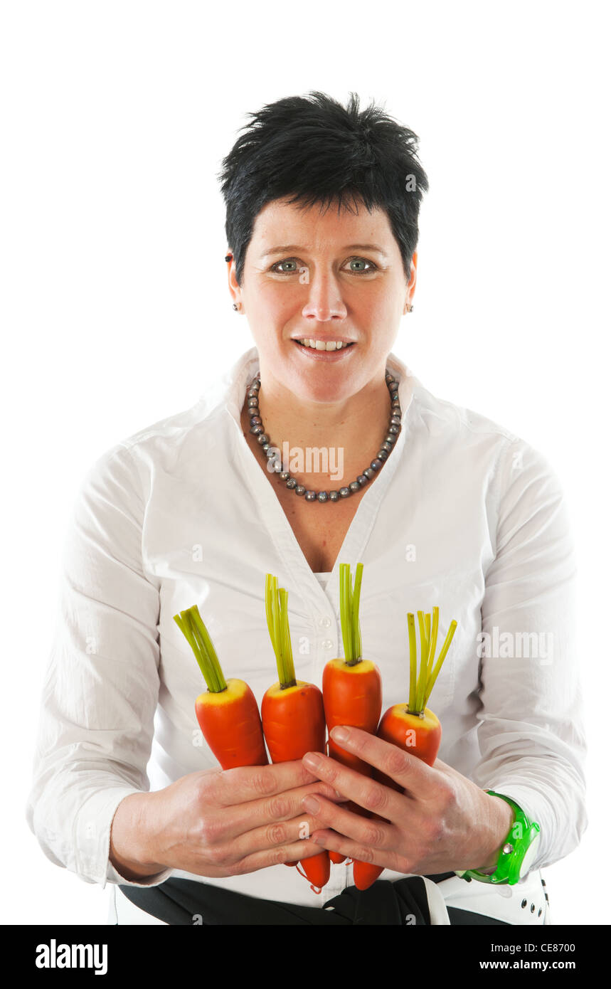 Portrait of a woman with carrots Stock Photo - Alamy