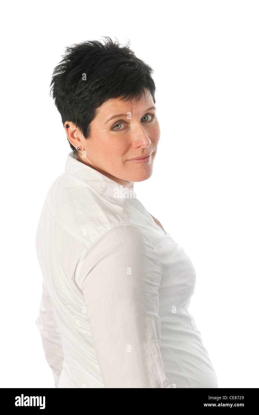 Young woman looking back as studio portrait Stock Photo - Alamy