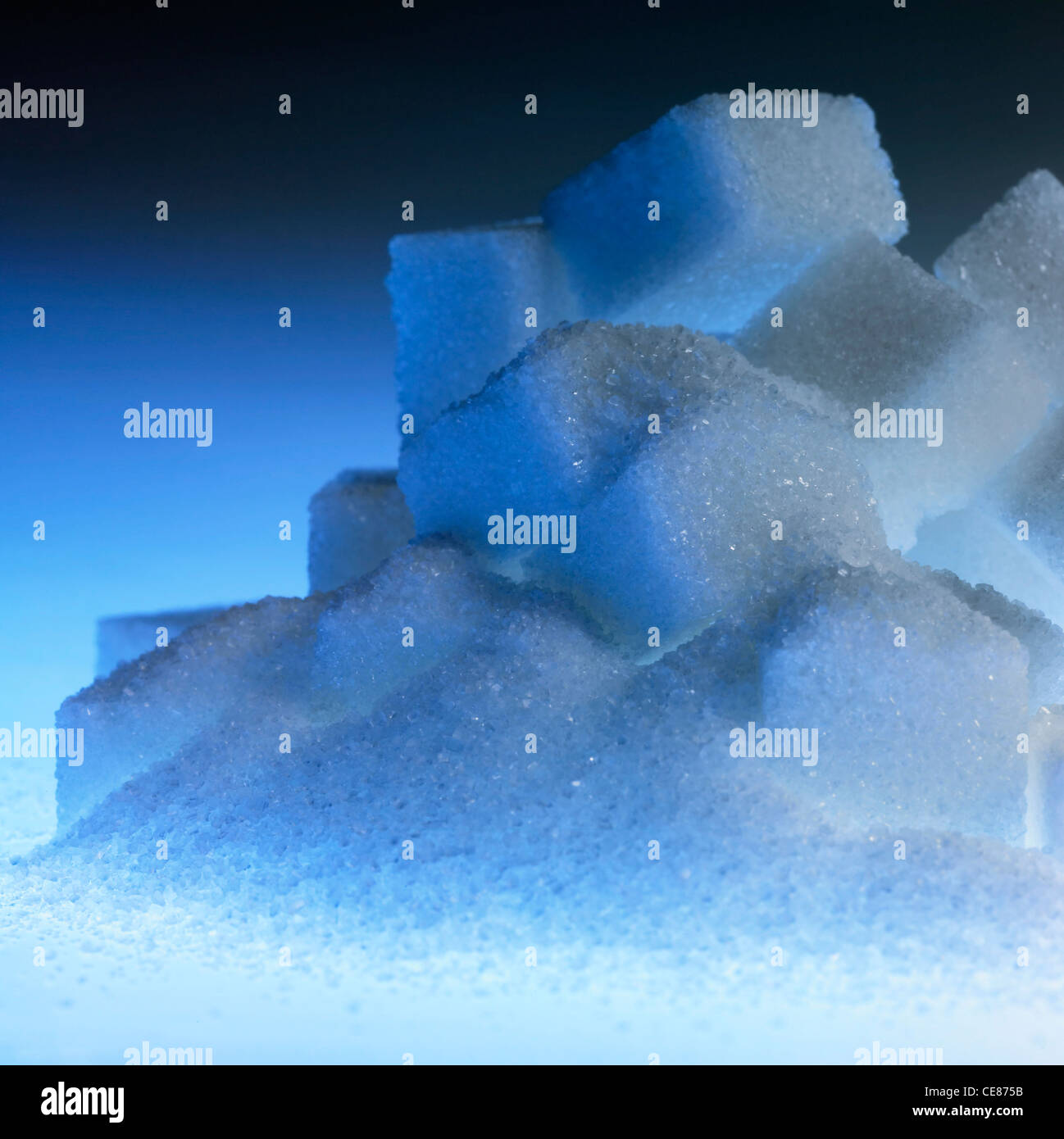 Studio photography of a lump sugar pile and blue light Stock Photo - Alamy