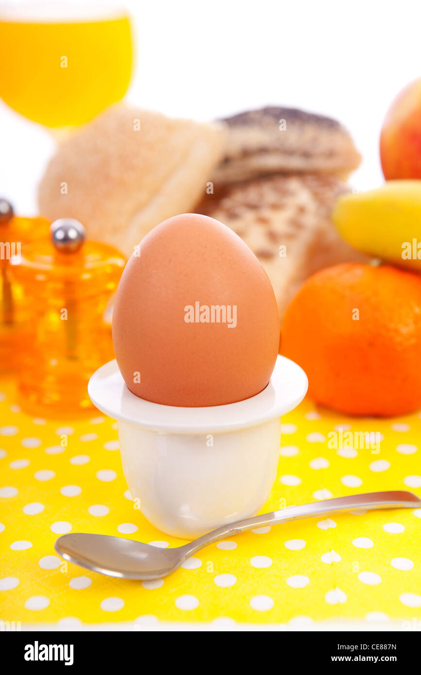 Breakfast with focus on egg and blurred food in background Stock Photo ...