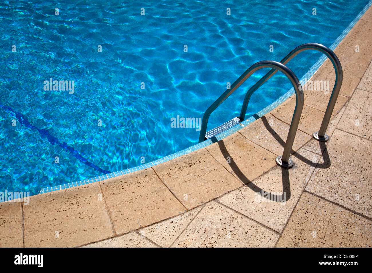 swimming pool blue water detail in summer time Stock Photo - Alamy