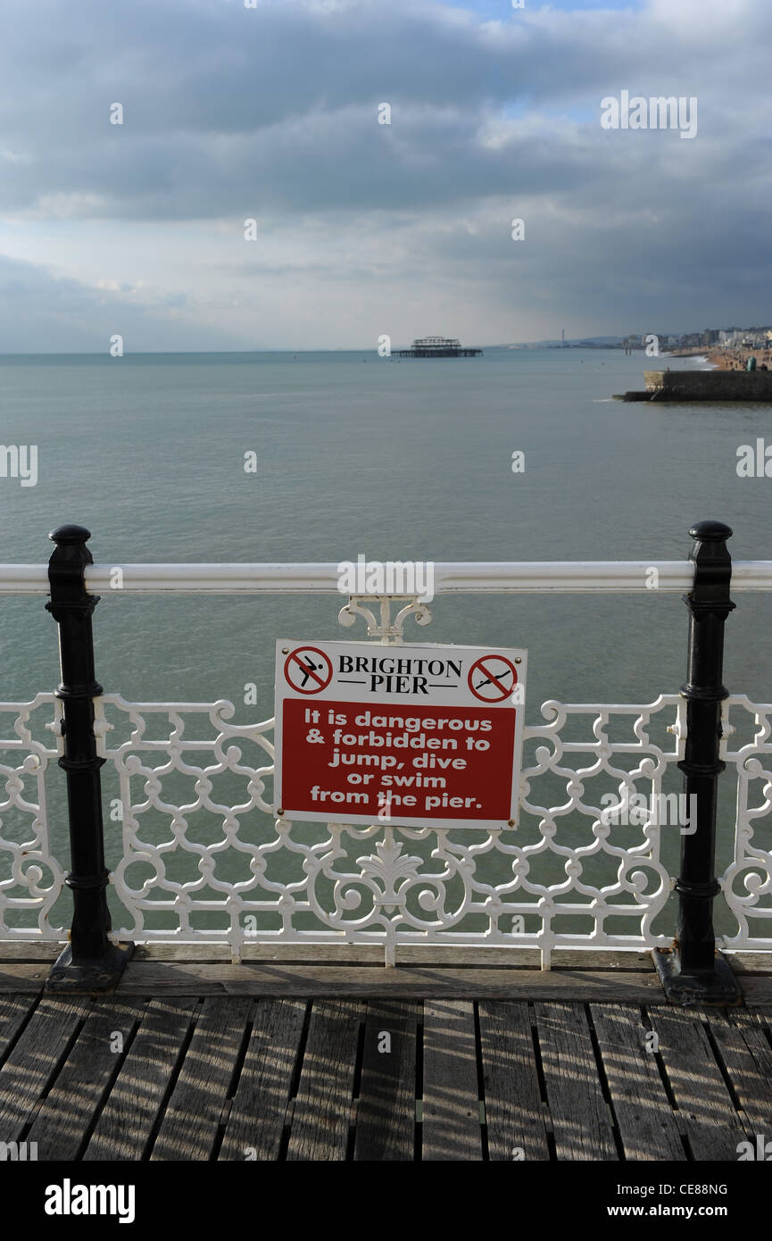 Warning sign on Brighton Palace Pier Stock Photo - Alamy
