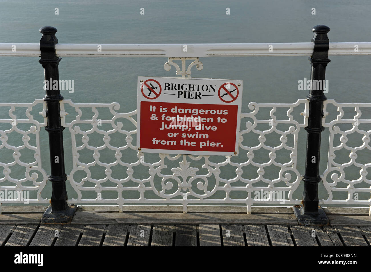 Warning sign on Brighton Palace Pier Stock Photo - Alamy