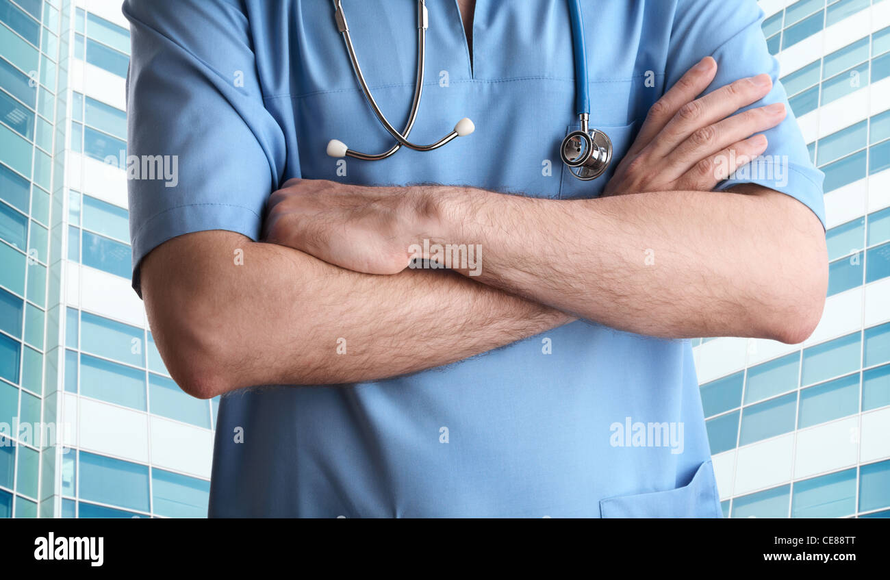 doctor with stethoscope in blue scrubs Stock Photo - Alamy