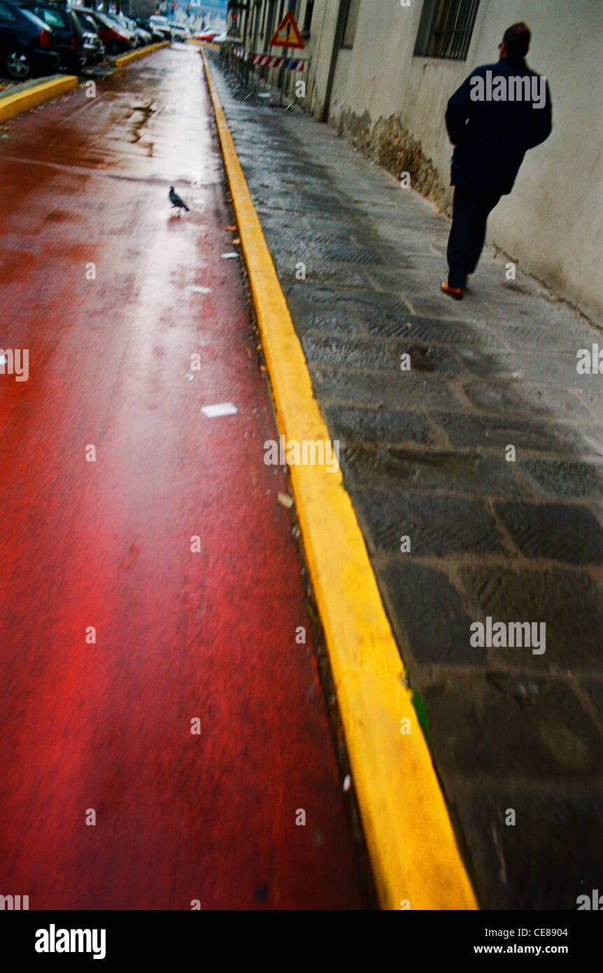 Man walking along road in Florence, Italy Stock Photo - Alamy