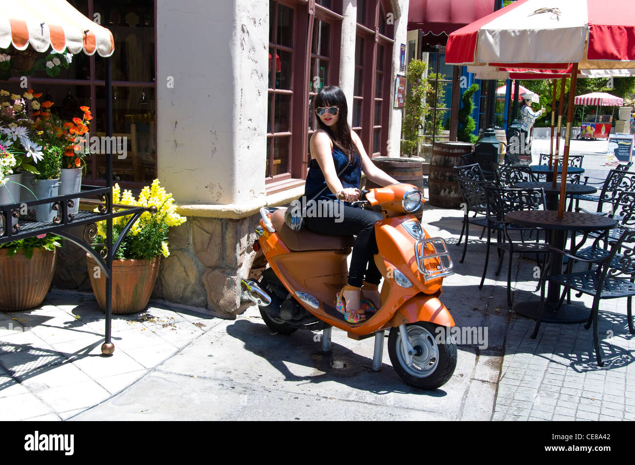 Girl riding scooter Stock Photo - Alamy