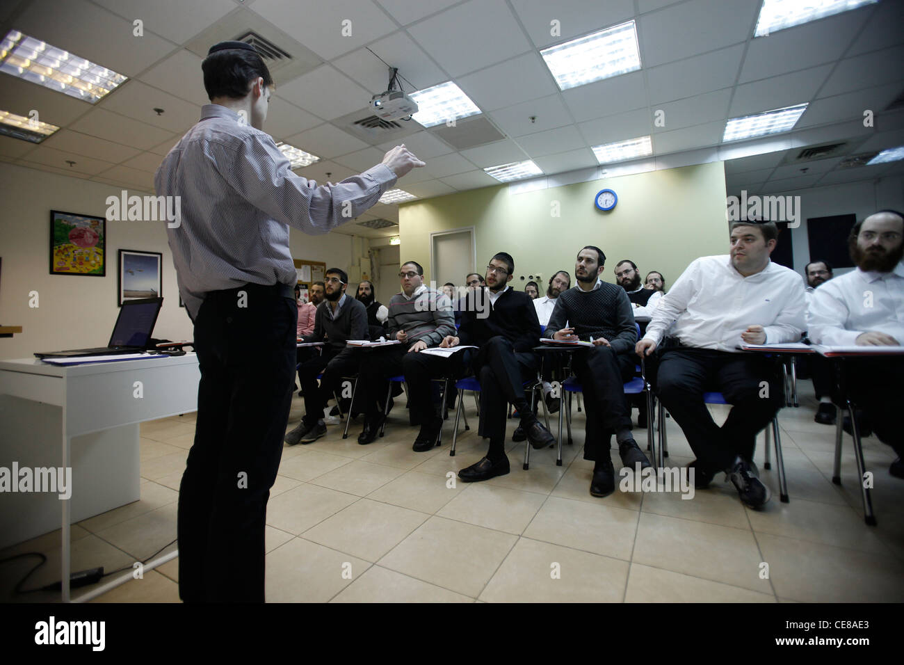 Orthodox religious Jewish men attending a lecture in the advertising ...
