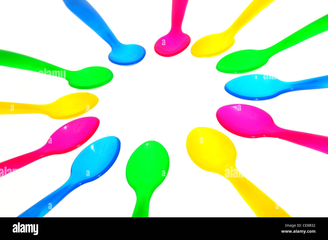 Twelve colorful spoons on a white background Stock Photo - Alamy