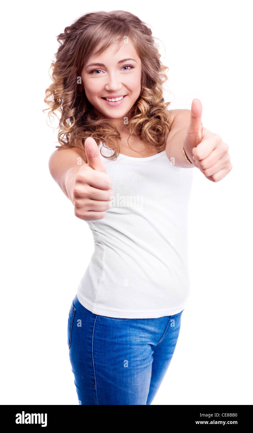 pretty happy young woman with her thumbs up, isolated against white ...