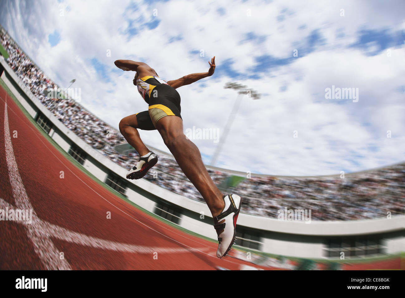 Runner On Race Track Leaving Starting Point Stock Photo - Alamy