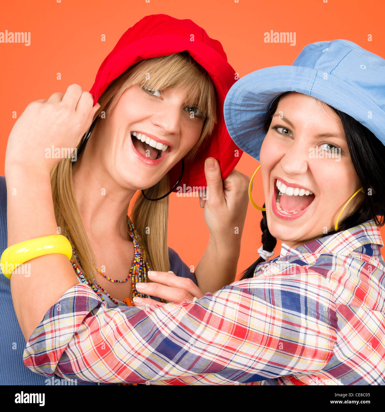Two woman friends young wear funny hats smiling crazy outfit Stock ...
