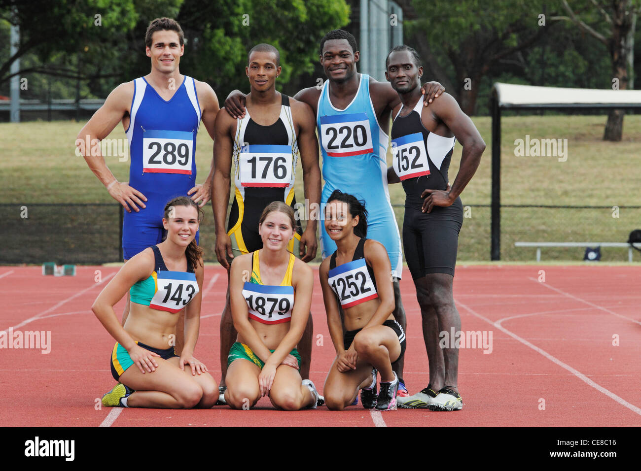 Athletes Posing On Race Track Stock Photo - Alamy