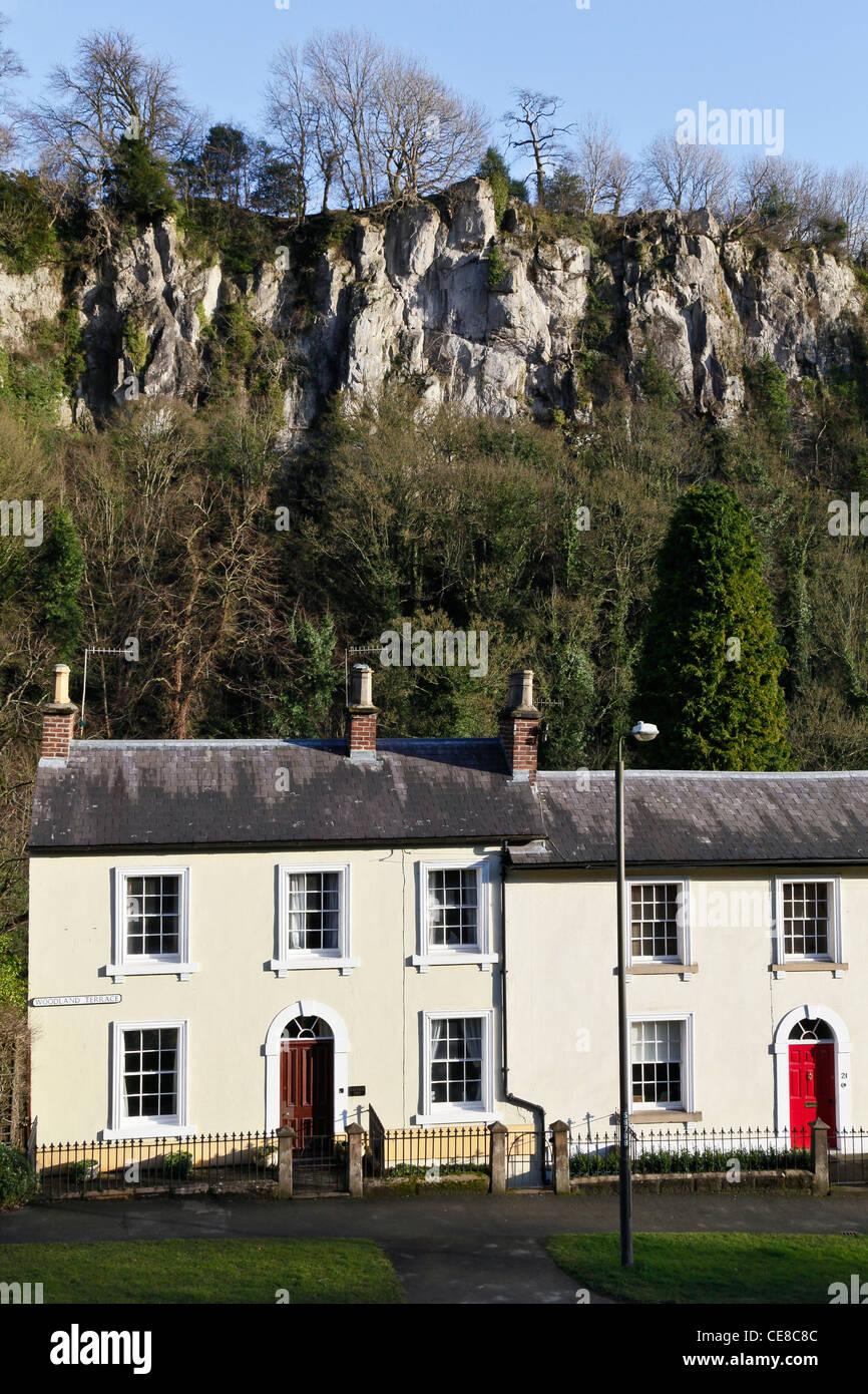 Cottages in front of limestone cliffs at Matlock Bath in the Derwent ...
