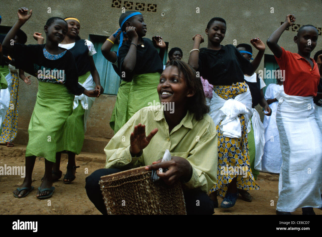 Girls performing a traditional dance to the beat of a drum in Kigali ...