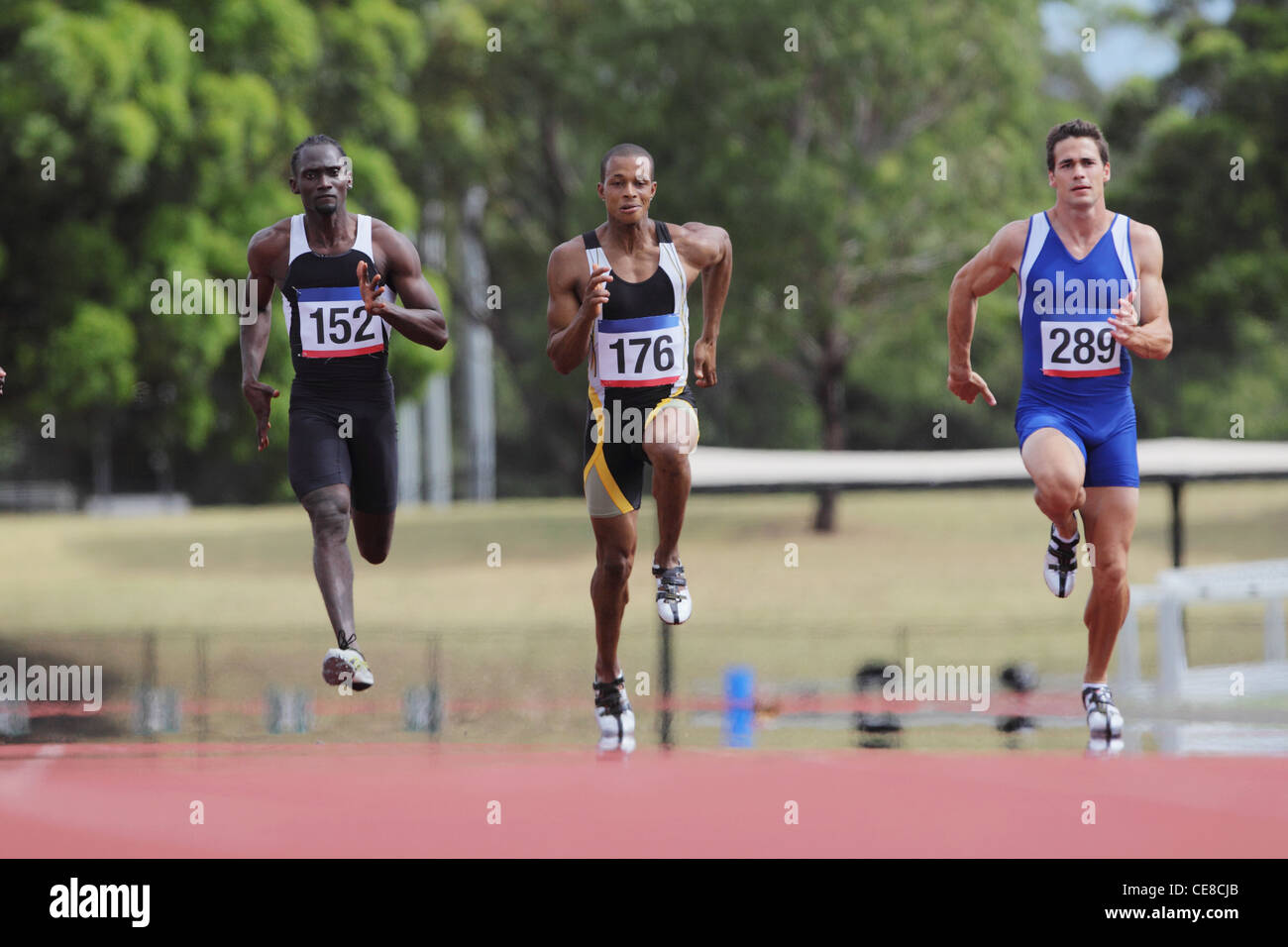 Males running on track hi-res stock photography and images - Alamy